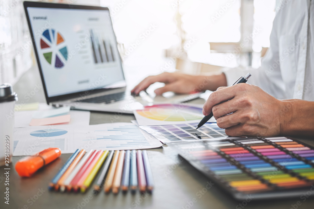 Young creative graphic designer working on project architectural ...