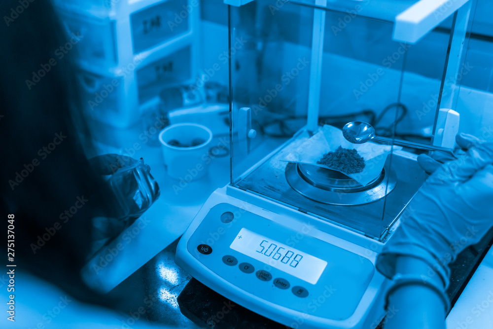 Asian scientist working in the lab,Experiment for customer,Using the formula, the physics and ...