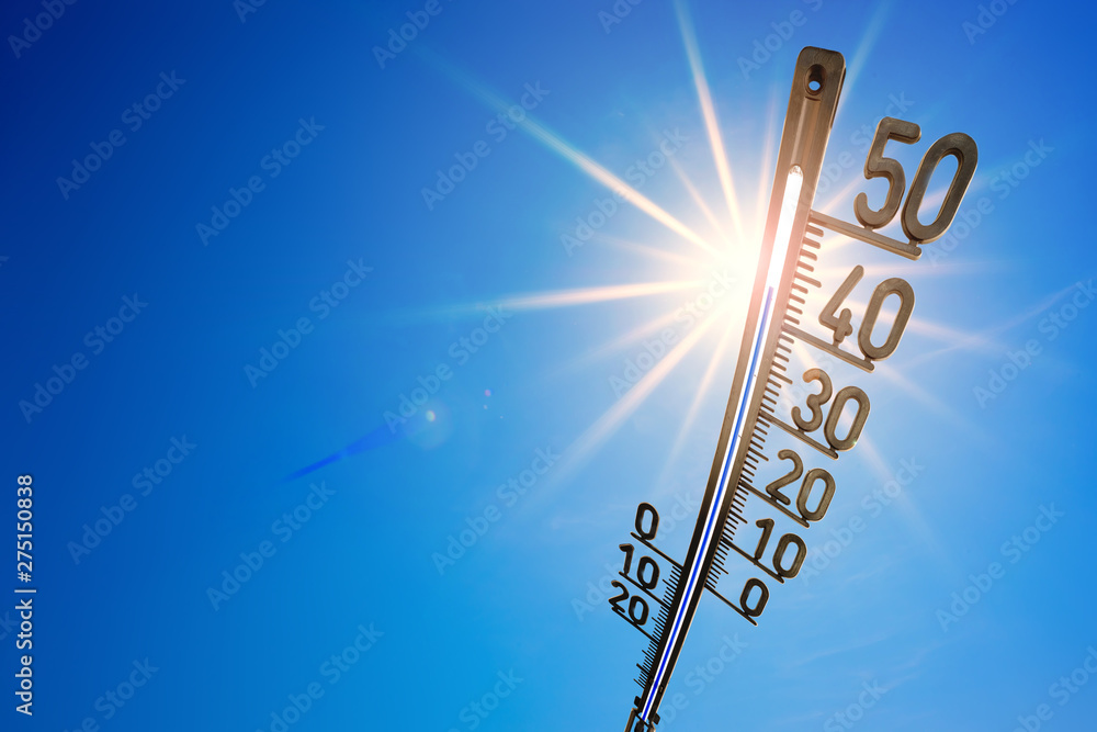 Hot summer or heat wave background, bright sun on blue sky with ...