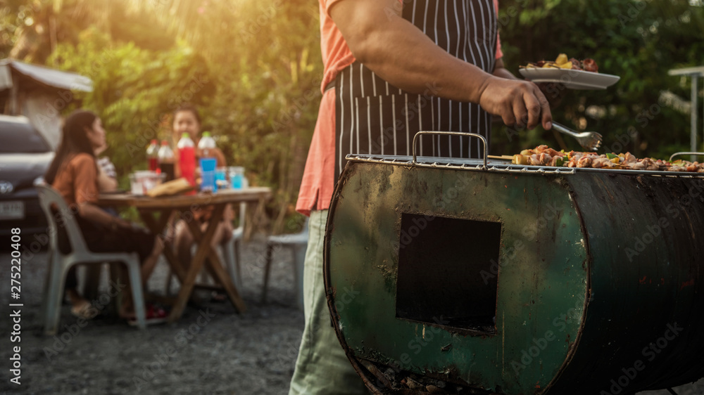 BBQ party group of people at barbecue dinner friends having food ...