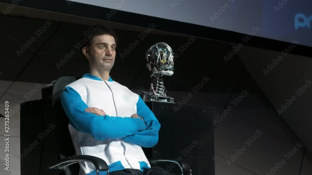 Humanoid robot man on stage. Innovative development in robotics and ...