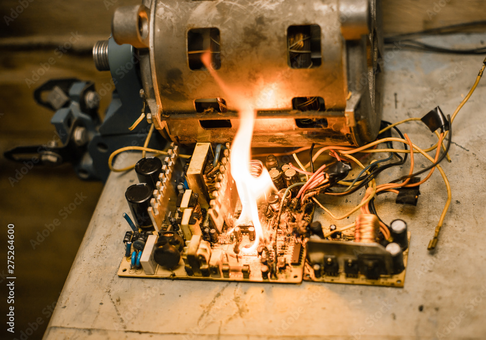 Overloaded electrical circuit causing electrical short and fire. Short ...