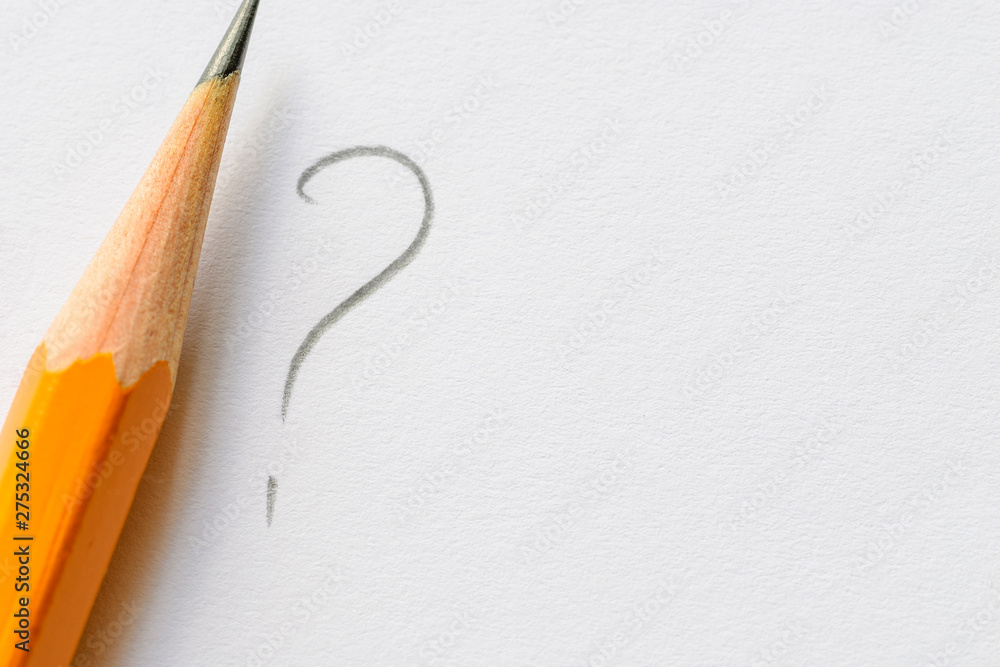 Pencil next to question mark on white paper Stock Photo | Adobe Stock