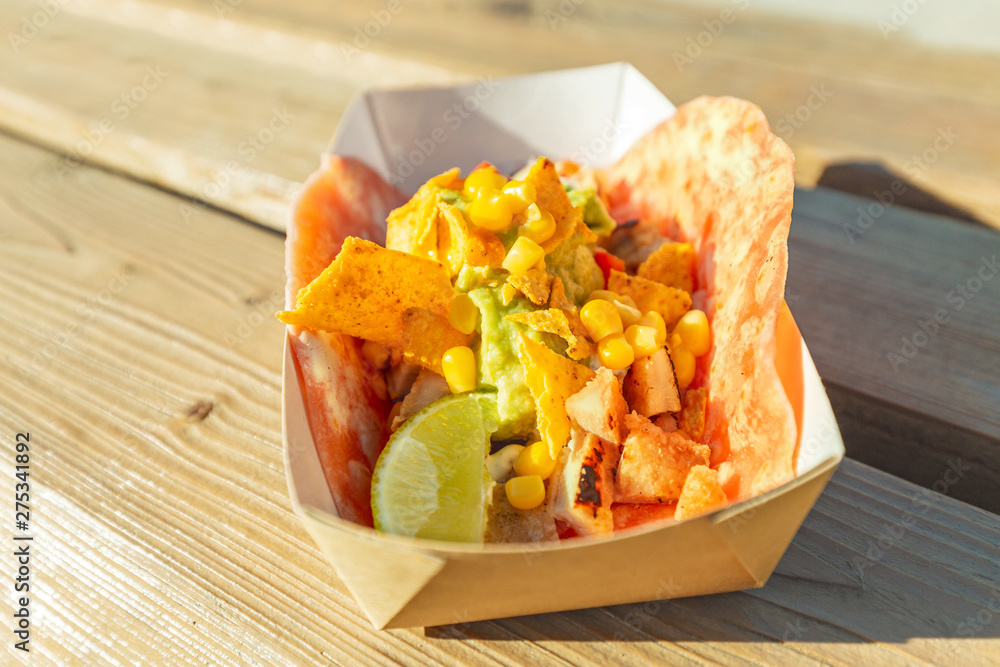Mexican takeaway street food taco in paper disposable dish Stock Photo ...