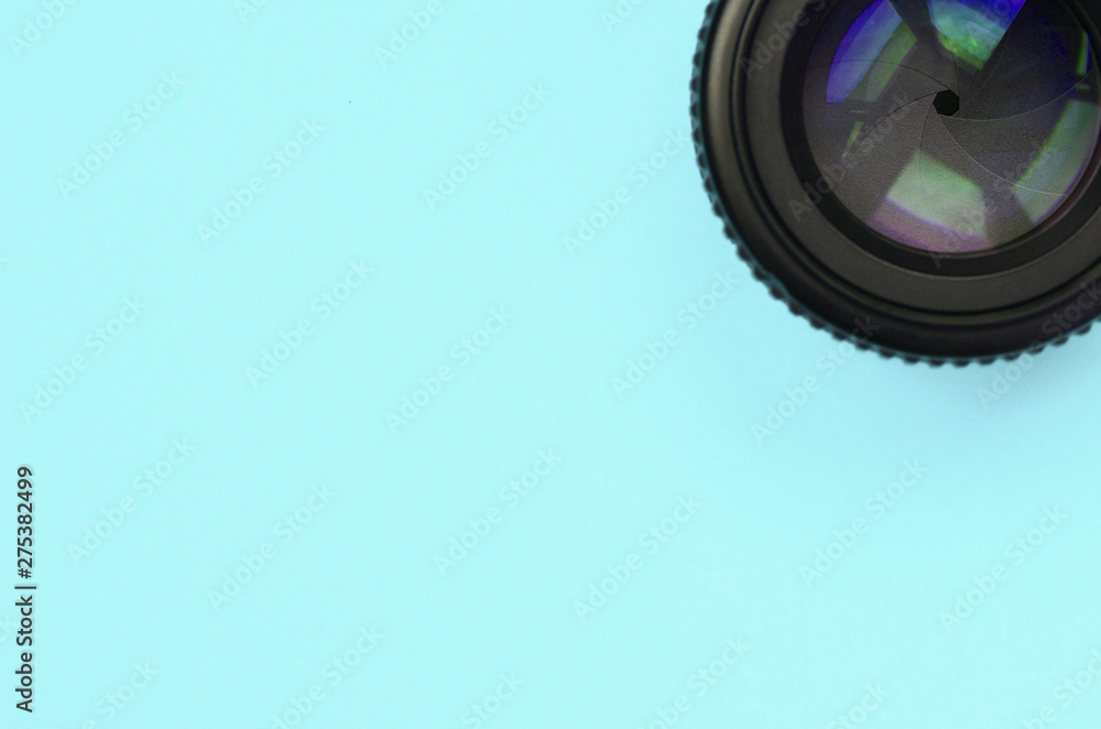 Camera lens with a closed aperture lie on texture background of fashion ...