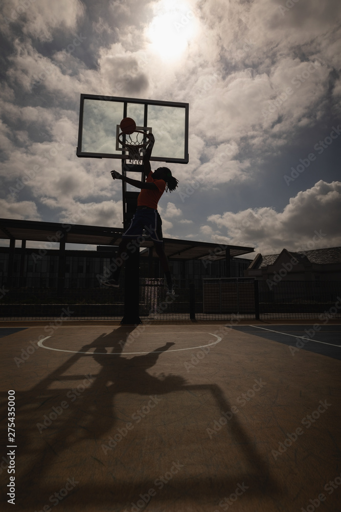 Basketball player playing basketball at basketball court Stock Photo ...