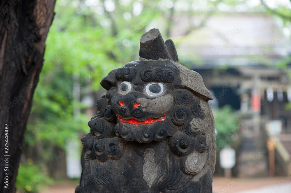 Lion stone scupture with red painted mouth, Yanaka, Tokyo, Japan Stock ...