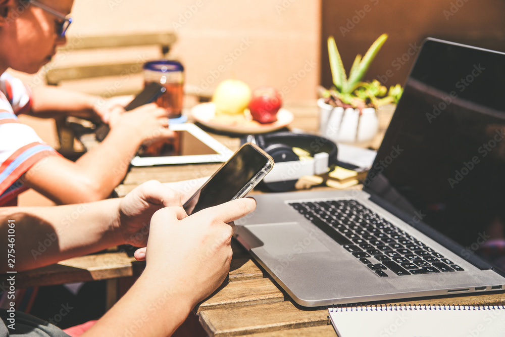 Friends having fun playing with tech modern device. Young boy making ...