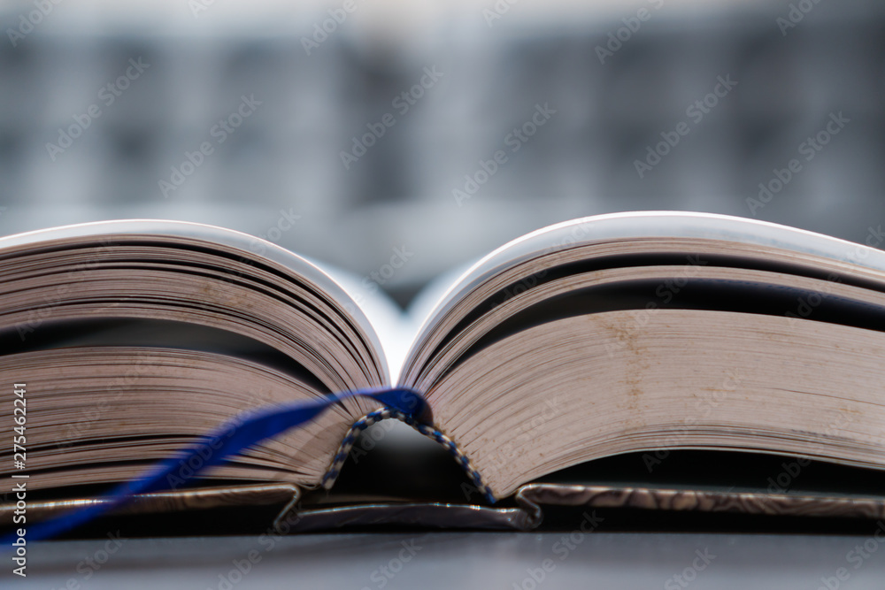 Reading old textbook in university library, read book or relaxing in ...