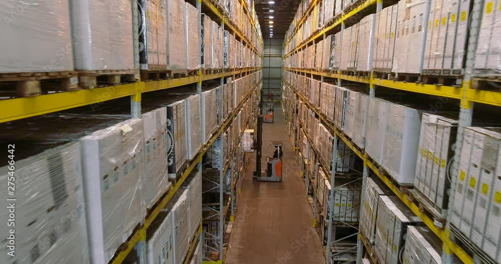 Forklift in a large modern warehouse, work of forklifts in a warehouse ...