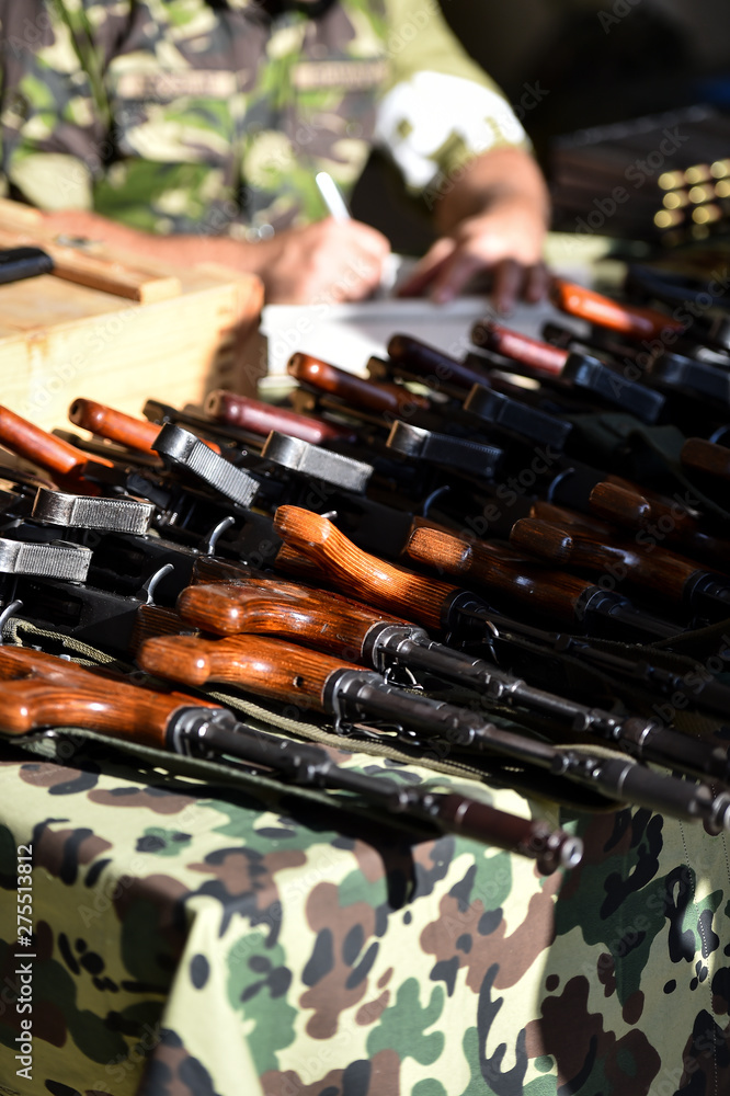 Assault rifles and round magazine loaders in a shooting range Stock ...