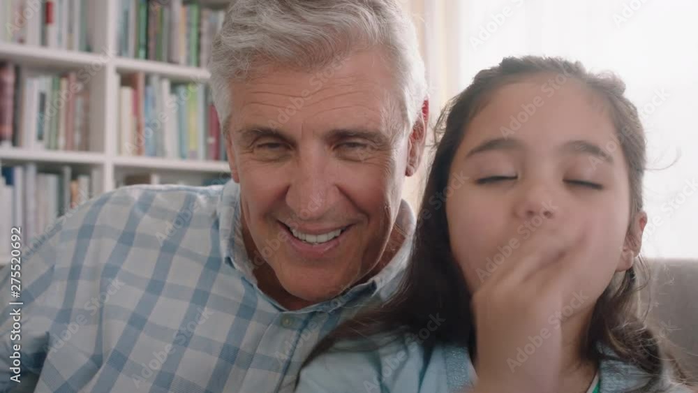 grandfather and child having video chat little girl sharing vacation ...