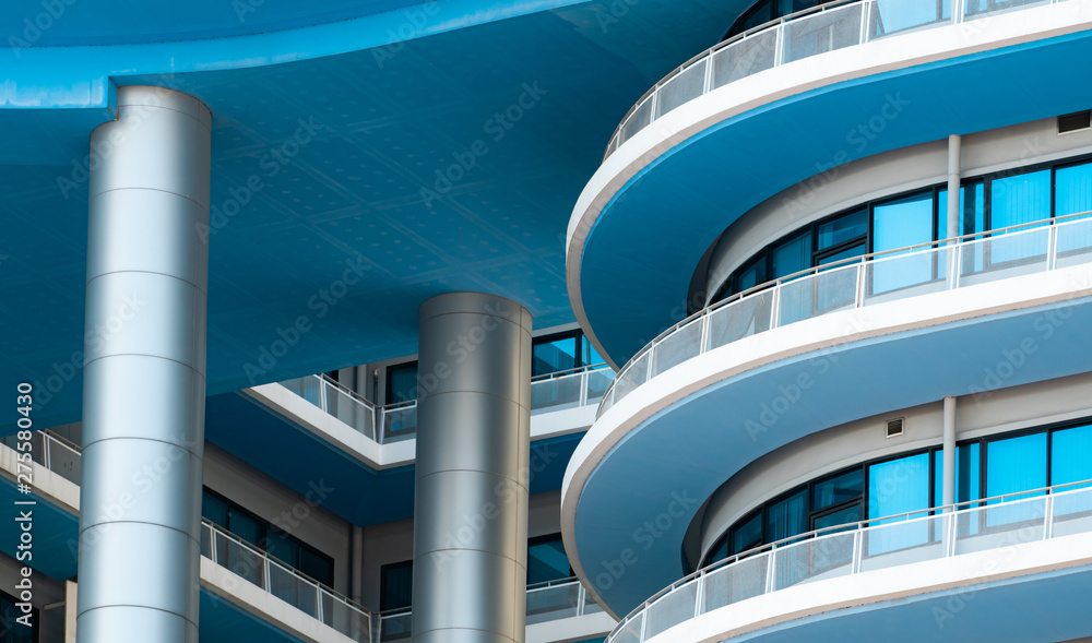 Closeup white and blue building with glass window. Modern architecture ...