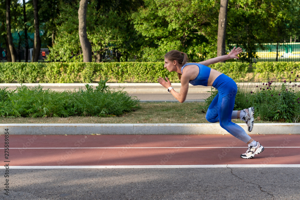 girl at start of running track. Running on cross. Sports start. girl in ...