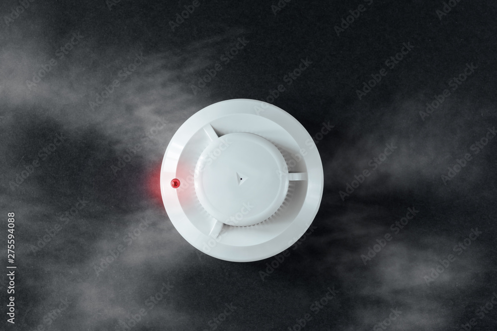 smoke detector and fire detector on a black background.Fire Alarm flat ...