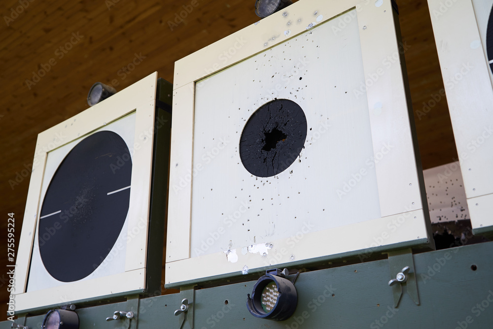 Bullseye target with bullet holes in center, close-up. Gun shooting ...