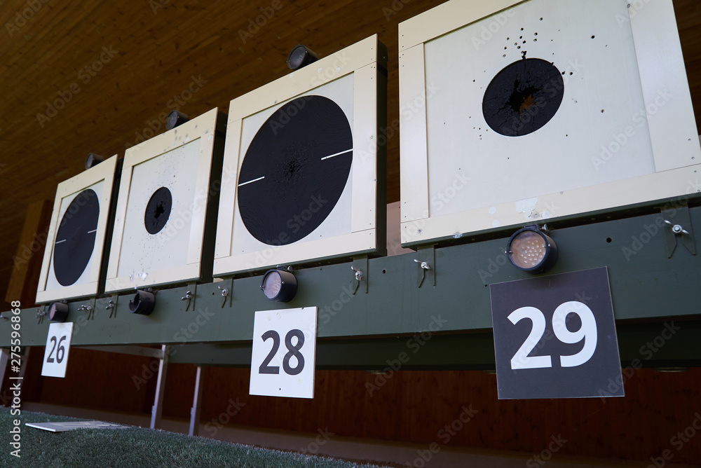 Bullseye target with bullet holes in center, close-up. Gun shooting ...
