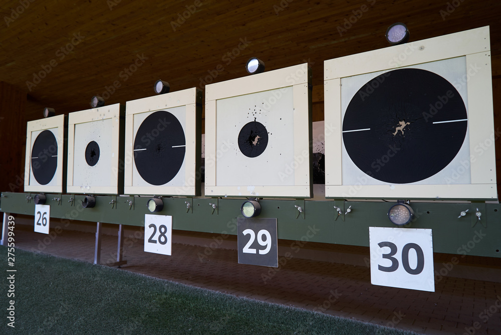 Bullseye target with bullet holes in center, close-up. Gun shooting ...