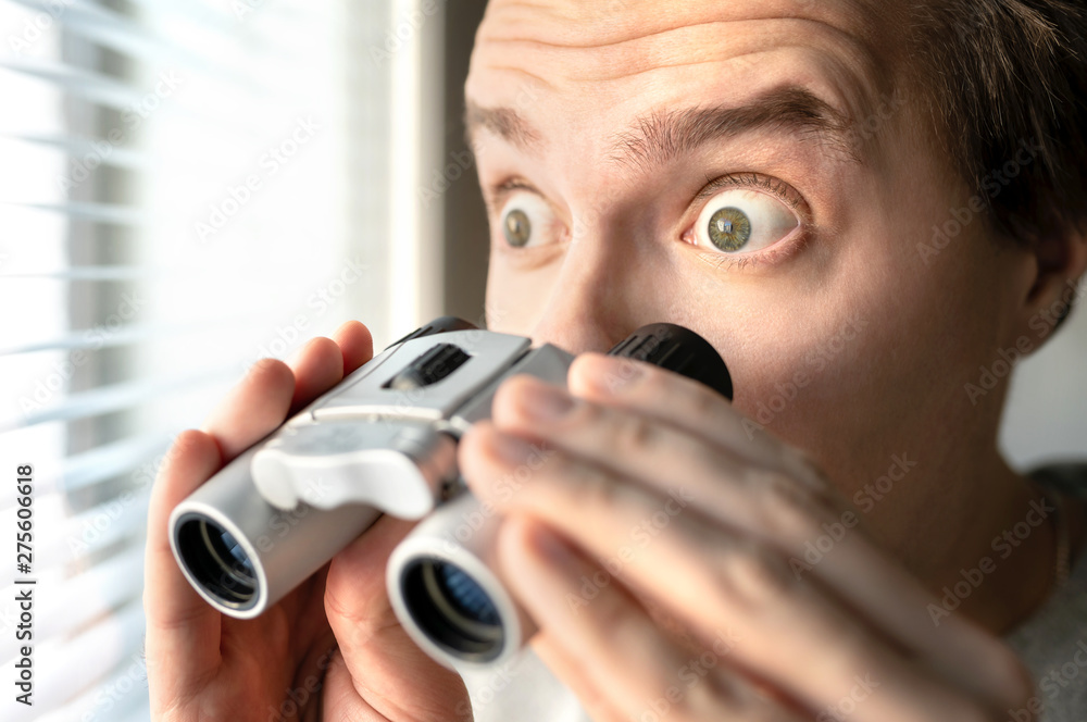Surprised man with binoculars. Curious guy with big eyes. Nosy ...
