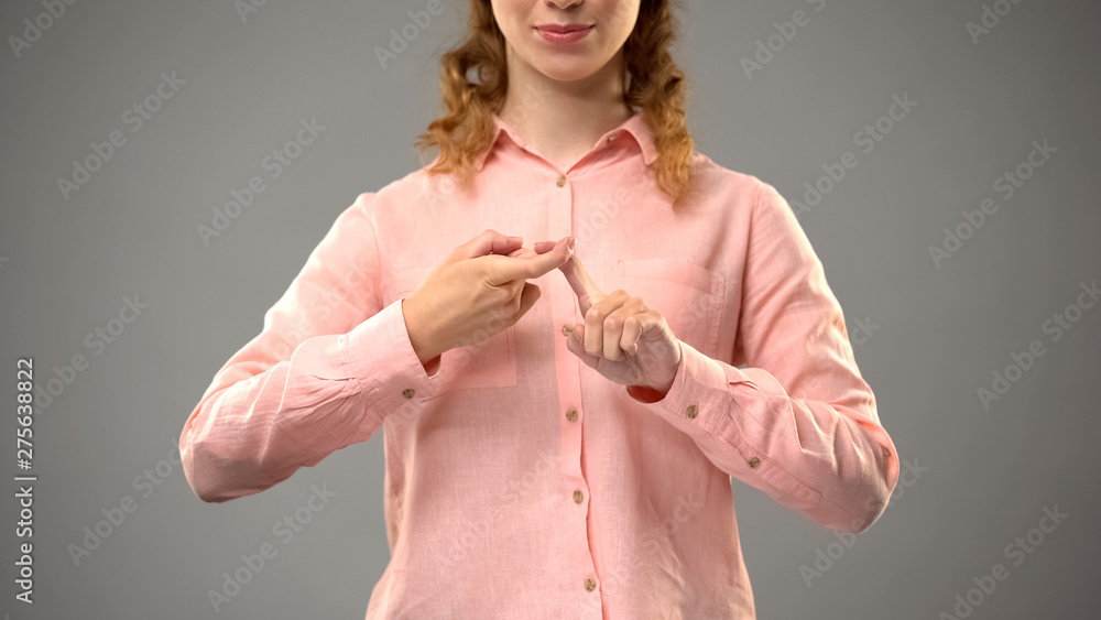 Woman saying friend in sign language, showing words in asl lesson ...