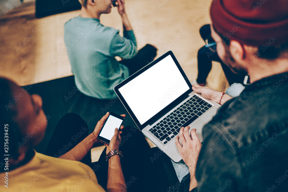 Cropped image of man sending multimedia content from his laptop ...
