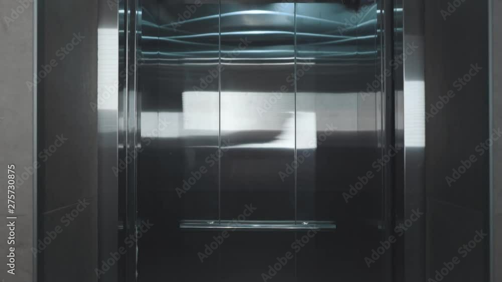 The elevator doors open. Opening the door is an elevator. Metal doors ...