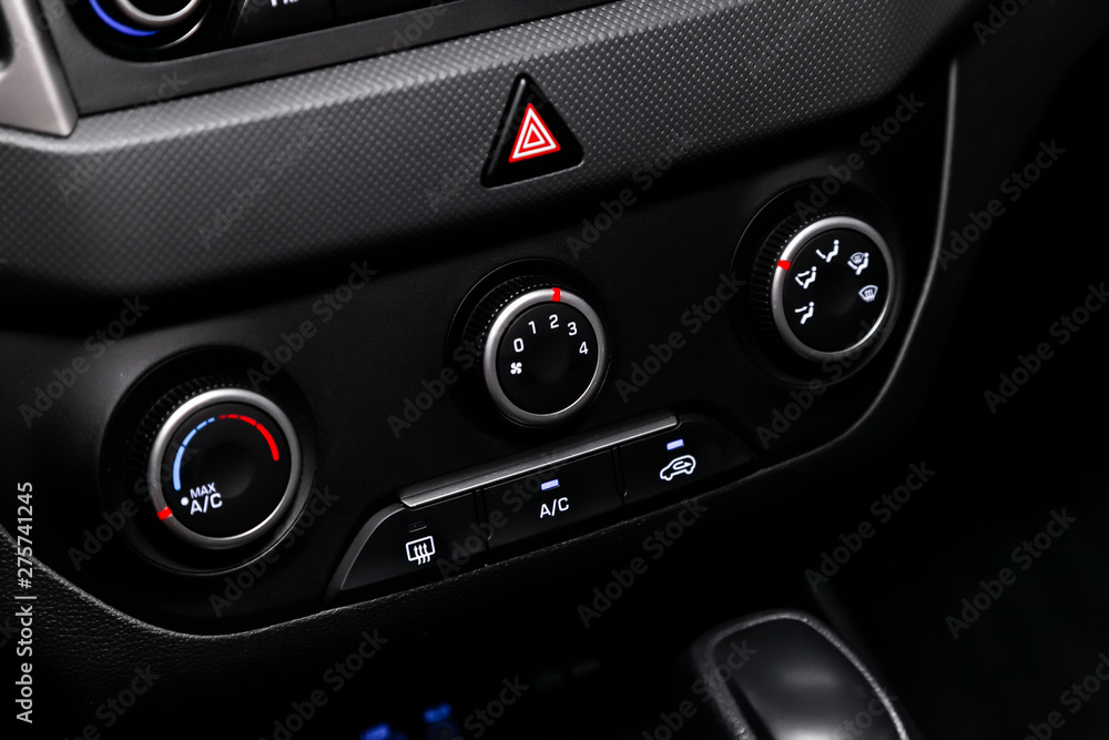 Black detail with the air conditioning button, the dashboard with ...