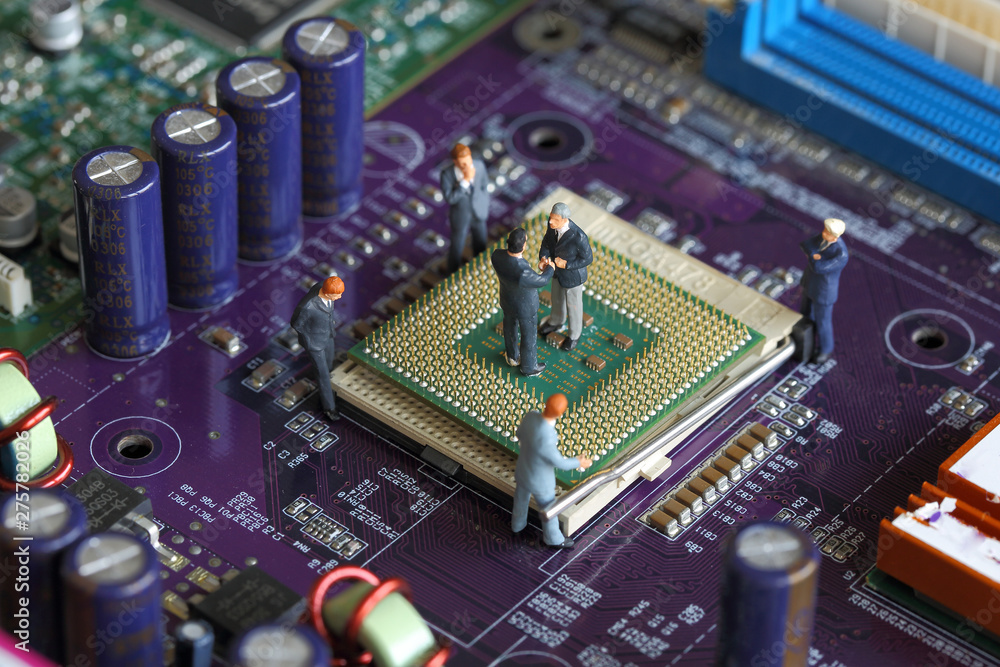 Selective focus of miniature businessman handshake about partnership on ...