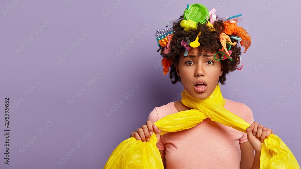 Curly dissatisfied African American woman suffers from suffocation ...