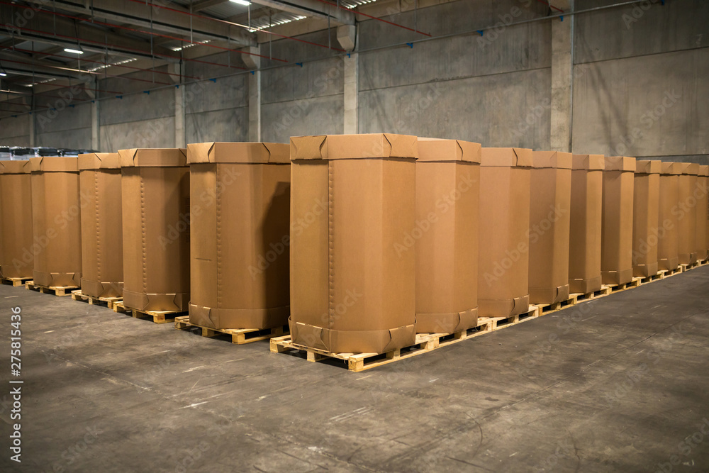 Stack of big industrial cardboard boxes. Craft Cargo Boxes stacked side ...