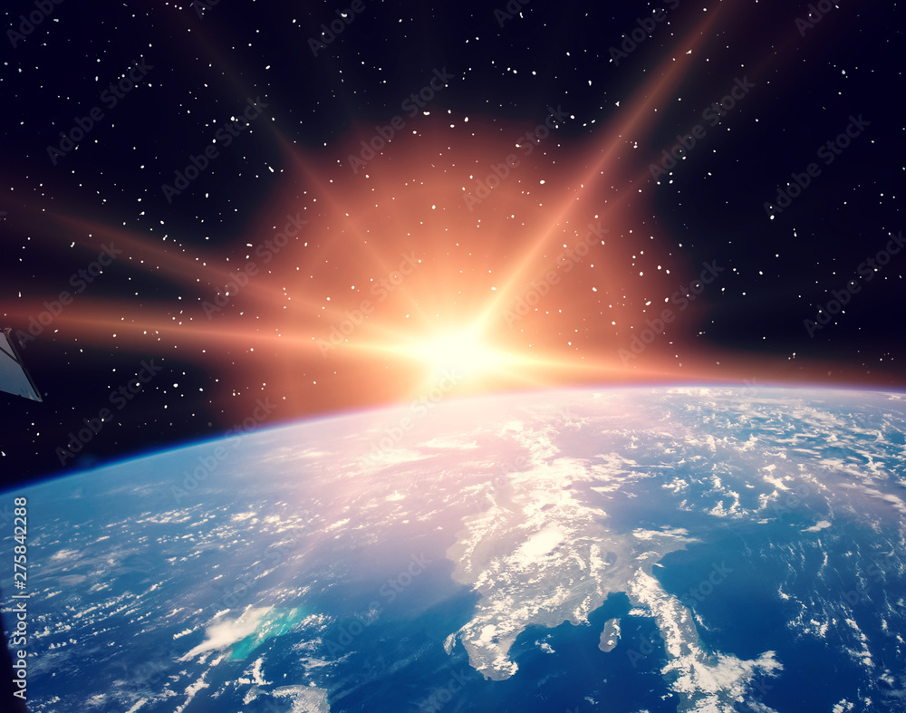 Earth from space during a sunrise. The elements of this image furnished ...