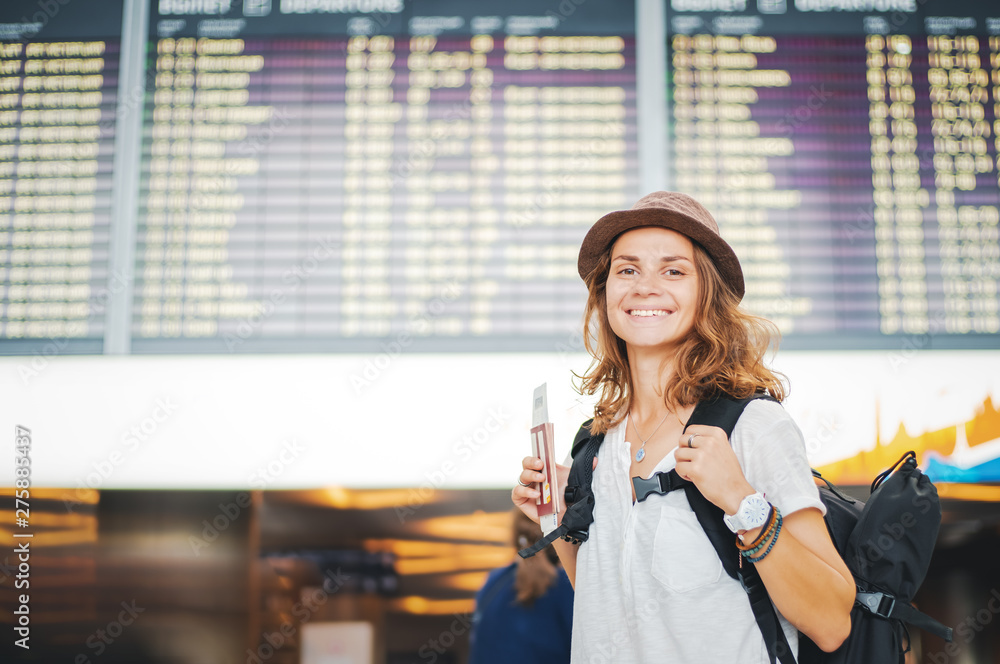 happy young girl traveler at the airport on the background of the ...