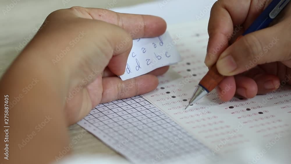 Hands university student holding pencil doing math multiple choice ...
