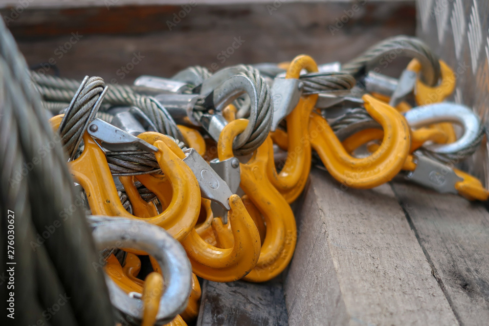 Yellow Grade 80 Sling Hooks attached to eye on Wire Rope Slings Stock ...