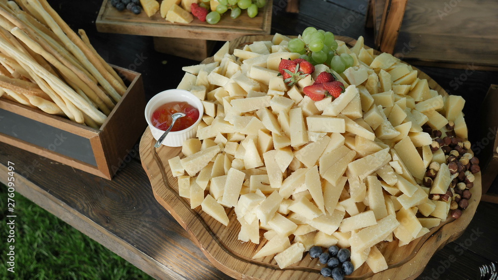 Catering service. Station with a large assorted cheese Cheddar ...