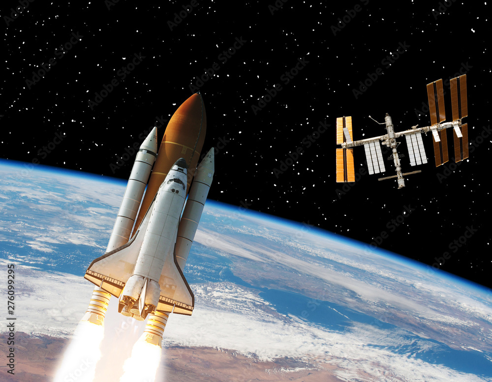 Rocket and space station above earth. Outer space. The elements of this ...