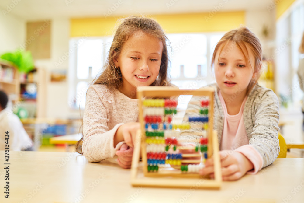 Girls are starting to learn as new schoolchildren Stock Photo | Adobe Stock