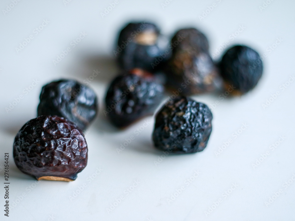 Sapindus rarak (lerak) on white background. In Indonesia lerak is used ...