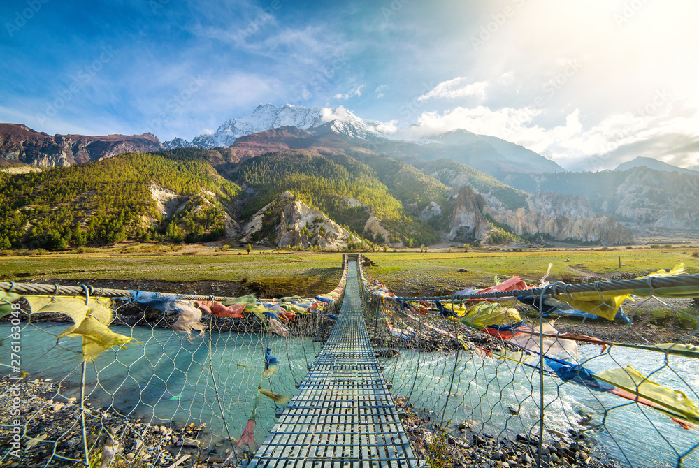 Suspension bridge with buddhist prayer flags Stock Photo | Adobe Stock