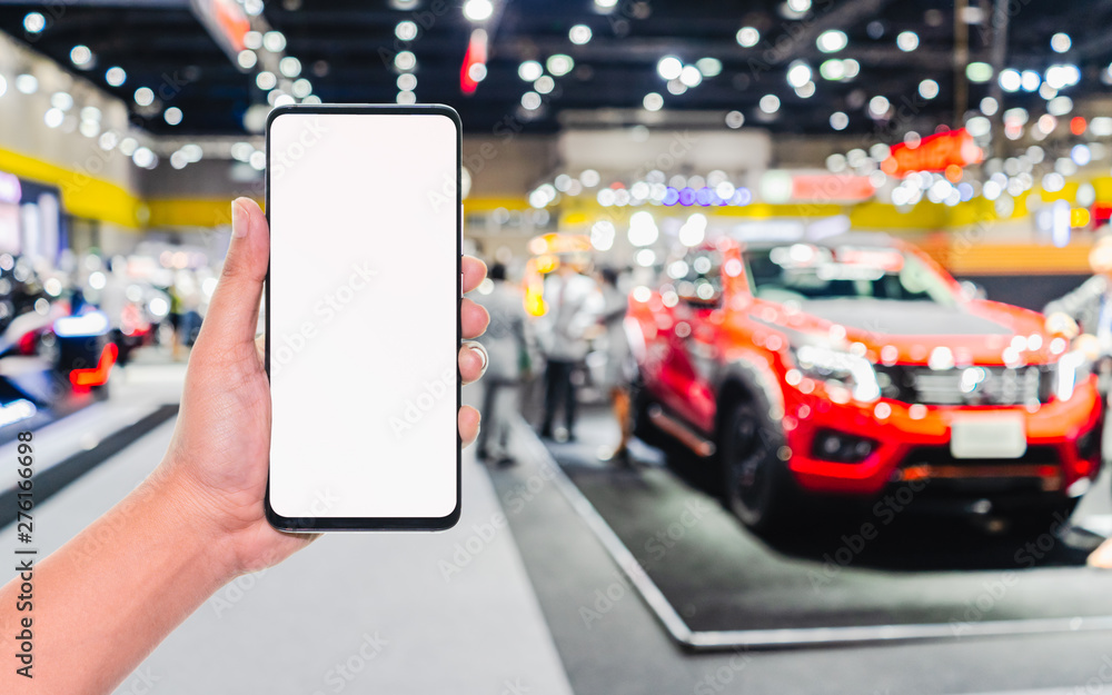 Mock up mobile phone. Hand holding mobile phone with abstract blurred ...