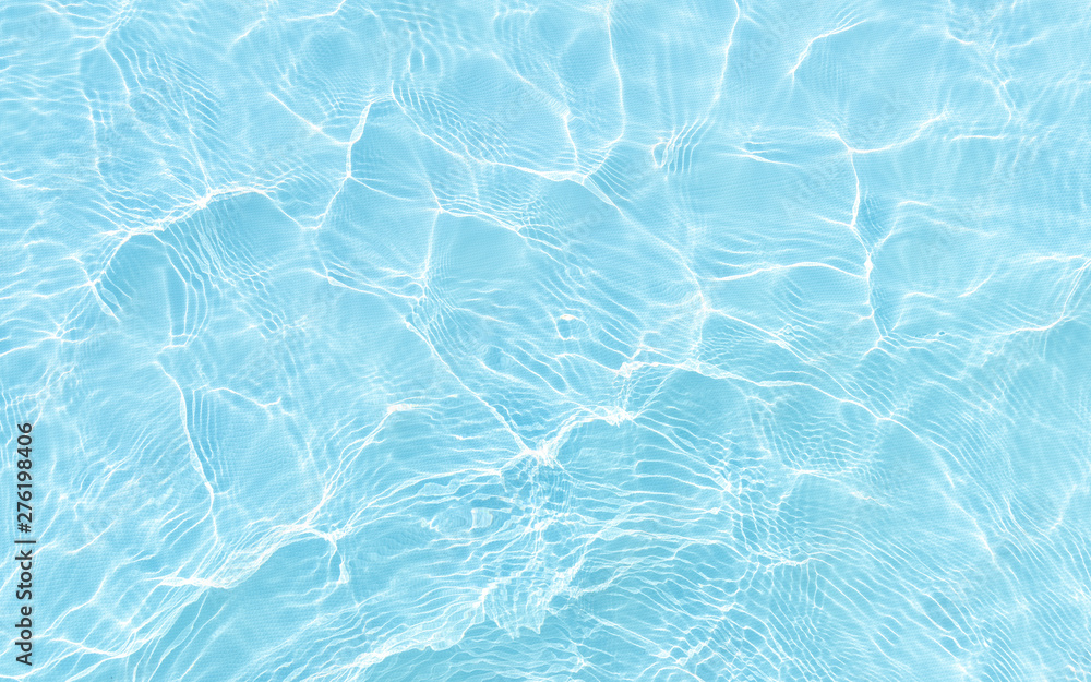 bright ripple surface of light blue swimming pool with sun reflect view from top see through ...