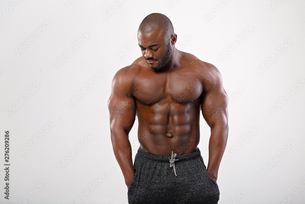 African American Athlete posing in studio. Shows body muscles Stock ...