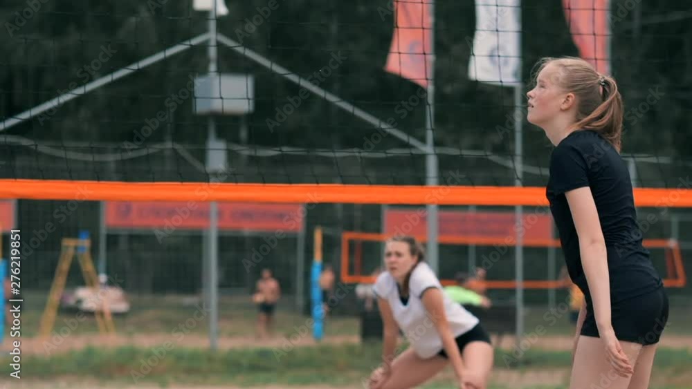 Four girls playing volleyball on the beach. Beach volleyball, net ...