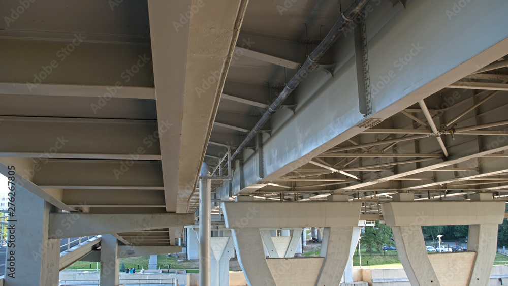 White massive, impressive overpass bridge . View from beneath ...