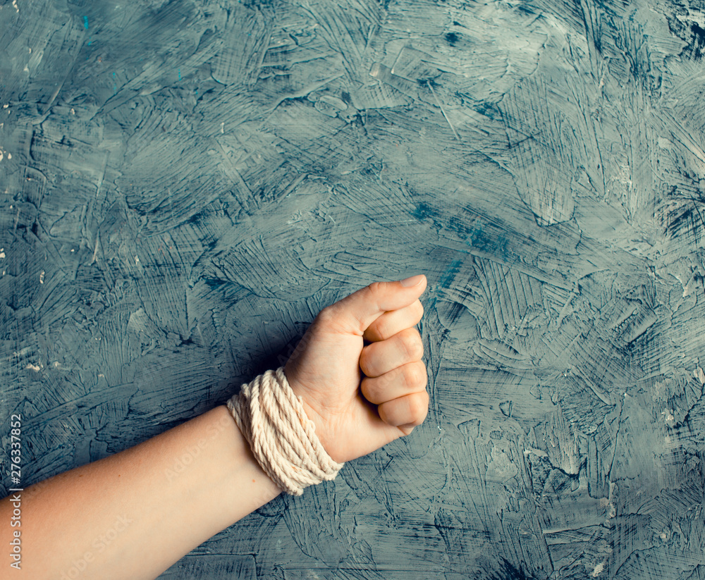 Hands of a missing kidnapped, abused, hostage, victim woman tied up ...