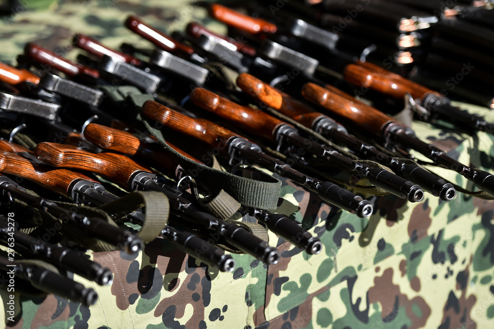 Assault rifles and round magazine loaders in a shooting range Stock ...