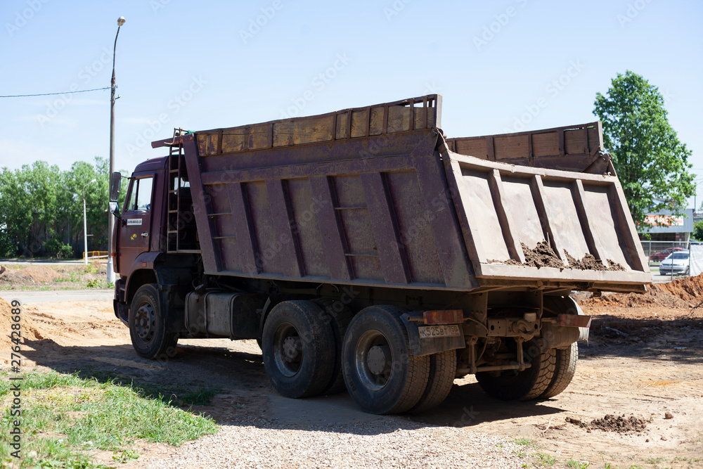 Dump truck At the construction site. Vehicles for the transport of ...
