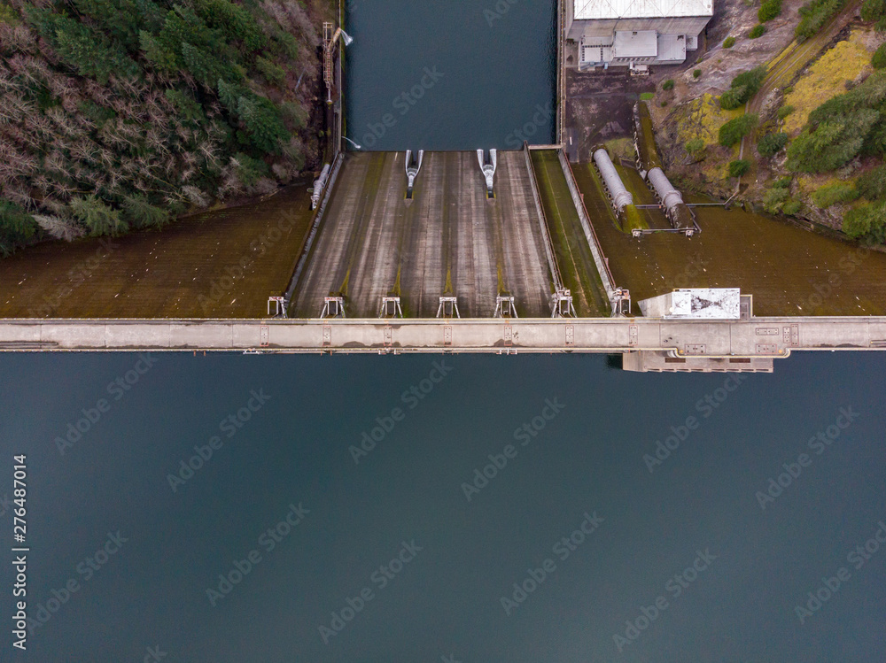 Aerial top down view at a dam of hydro electrical station. The dam is a ...