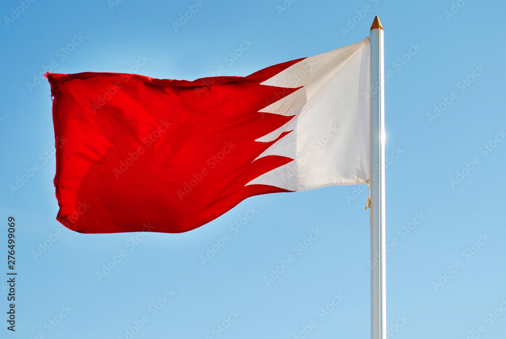 Bahrain flag waving with nice blue sky isolated Stock Photo | Adobe Stock