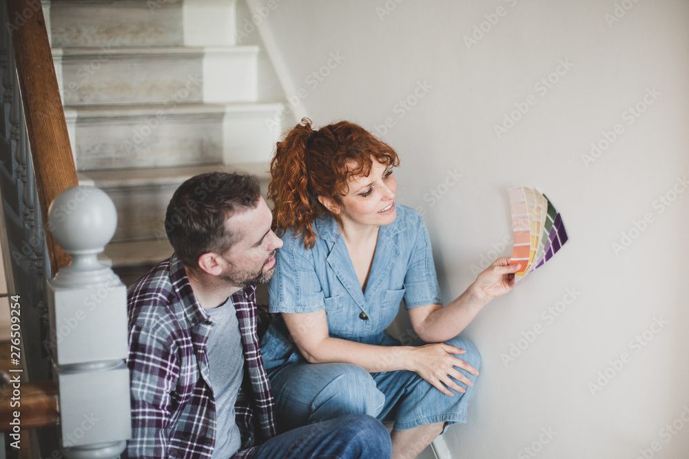 Couple choosing paint colors Stock Photo | Adobe Stock